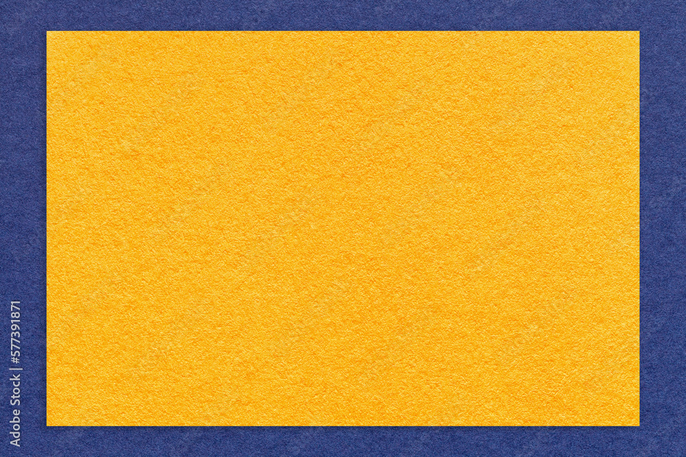Texture of craft yellow color paper background with navy blue border ...