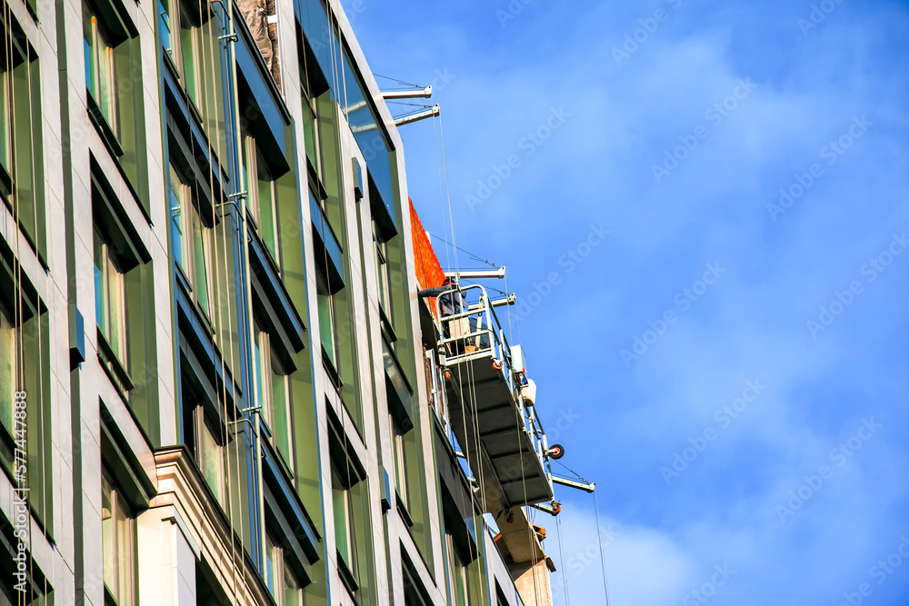 Suspended platform, construction cradle hanging on building ...