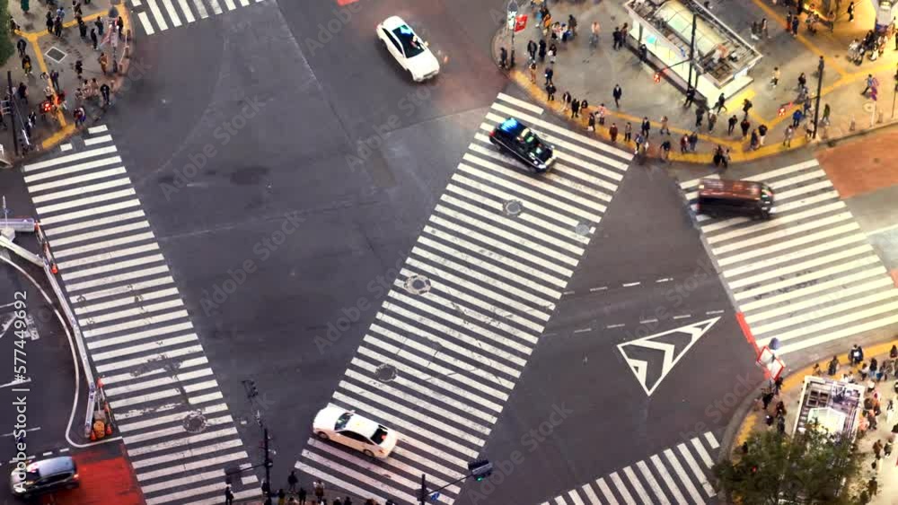 TOKYO - OCT 3rd, 2022: Aerial view of people and traffic crossing the ...