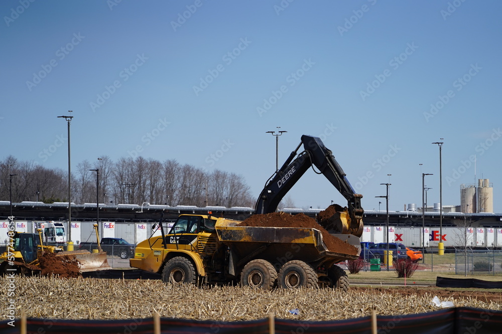 Articulated haul truck being used to move dirt and mud around. Stock ...