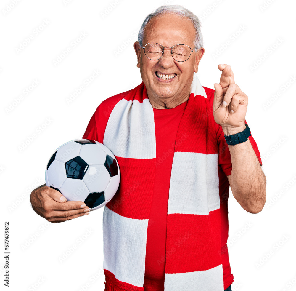 Senior man with grey hair football hooligan holding ball gesturing ...