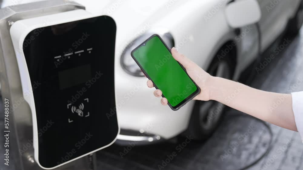 Mockup phone with green screen display energy status of electric ...