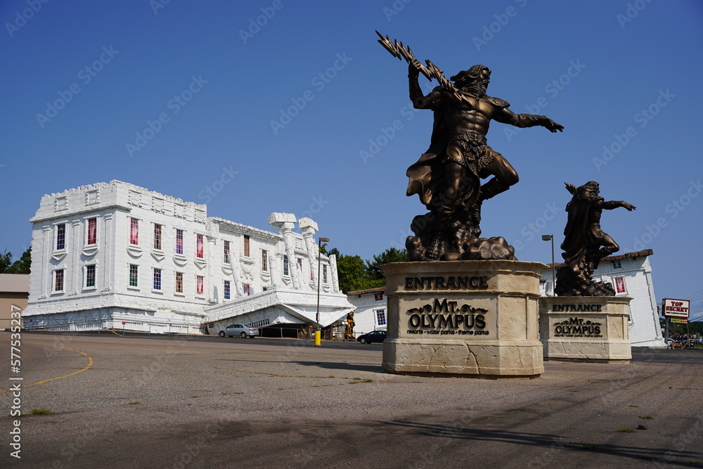 Statues of the Greek Demi-God Zeus sit in front of Mt. Olympus water ...