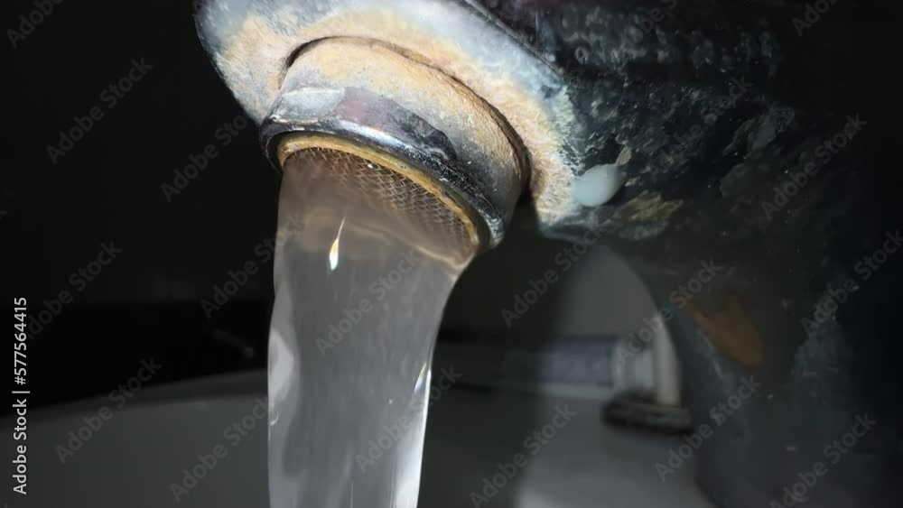 Washbasin faucet with scale on the aerator close-up. Dirty faucet with ...