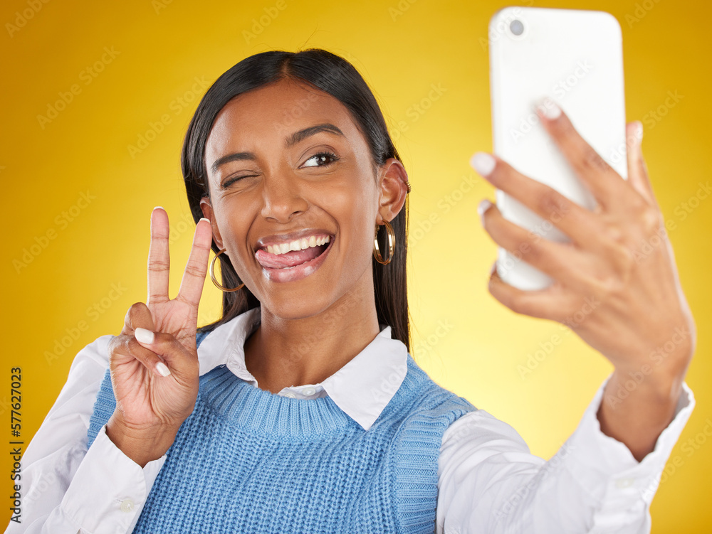 Selfie, face and peace with a woman in studio on a yellow background to ...