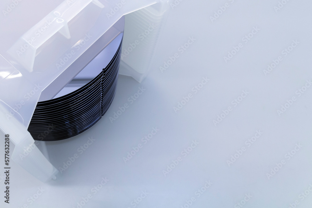 Poster A batch of silicon wafers packed in a plastic storage box in the ...
