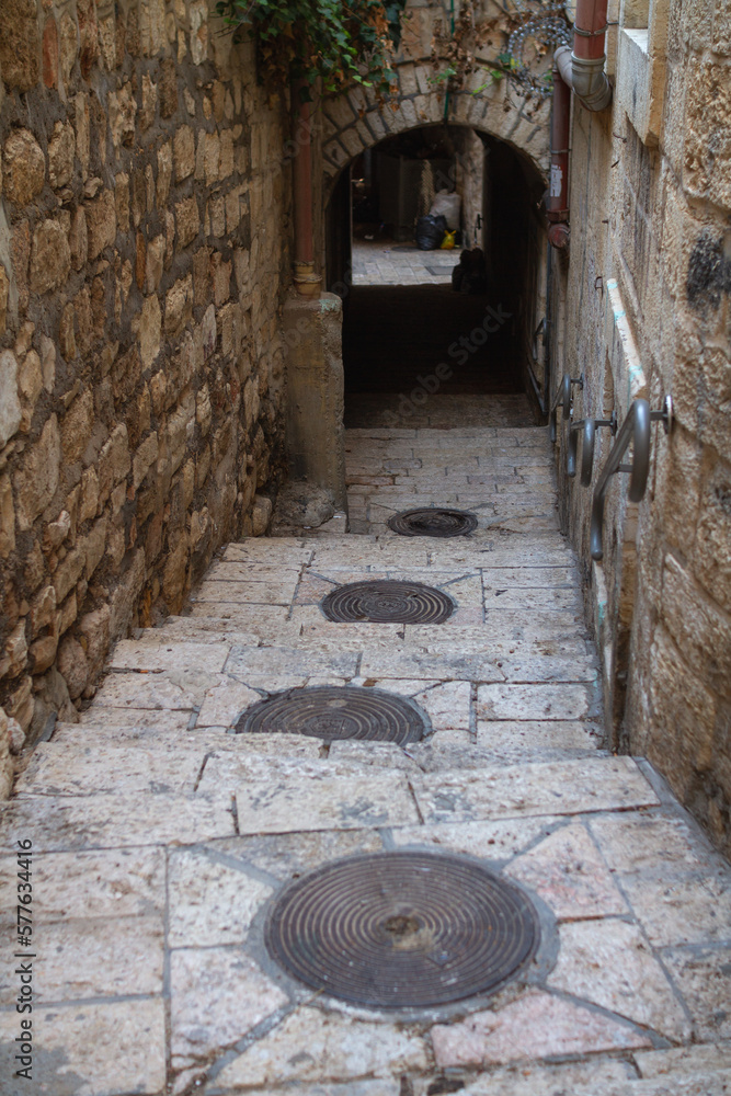 Jerusalem Old City streets: sewer manholes and arches Stock Photo ...