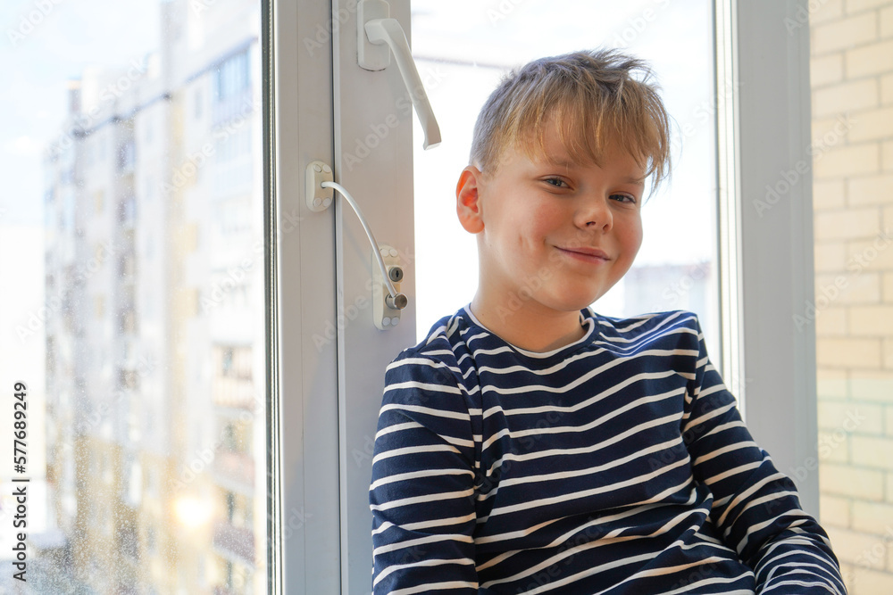 safety at home for small children. a lock on the window protects ...