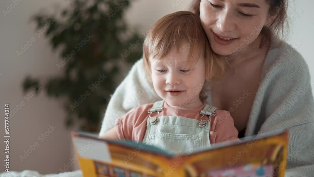 Caring single parent young mother babysitter hug happy cute little ...