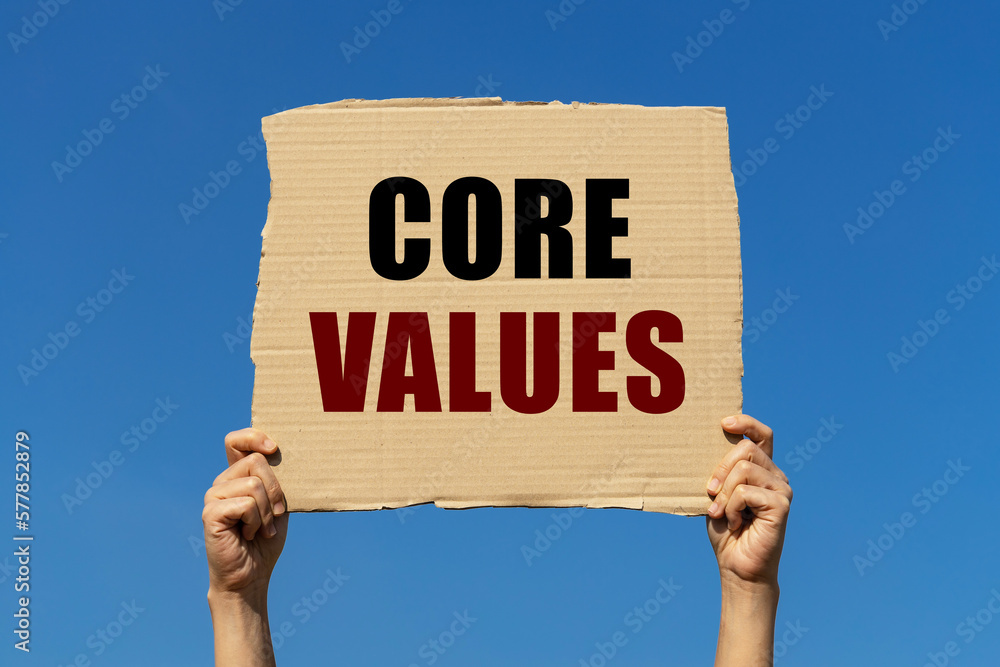 Core values text on box paper held by 2 hands with isolated blue sky ...