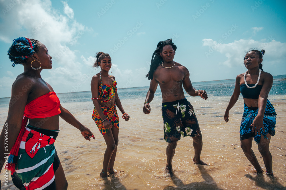 Kenyan people dance on the beach with typical local clothes Stock Photo ...