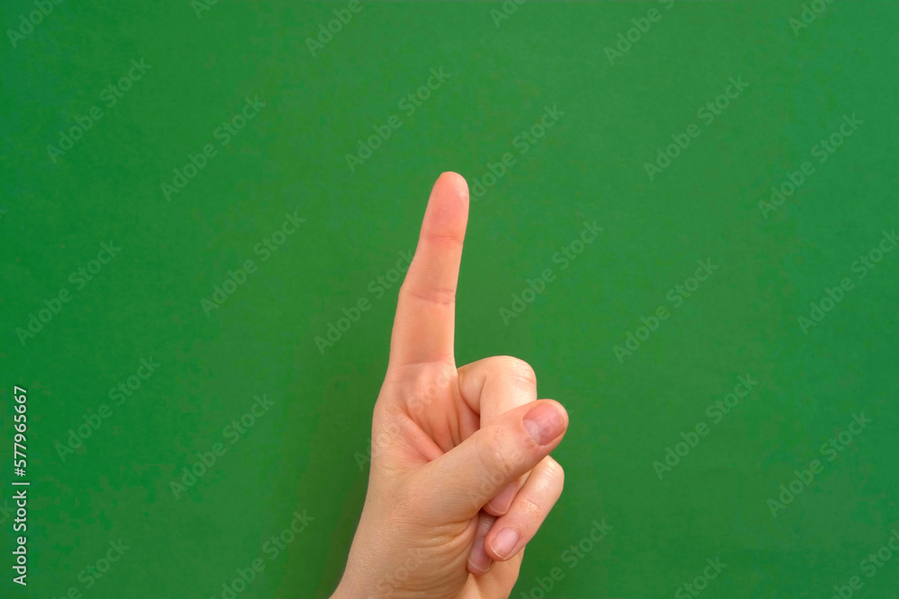 Foto de Female hand making warning gesture on Chroma key. Human hand ...