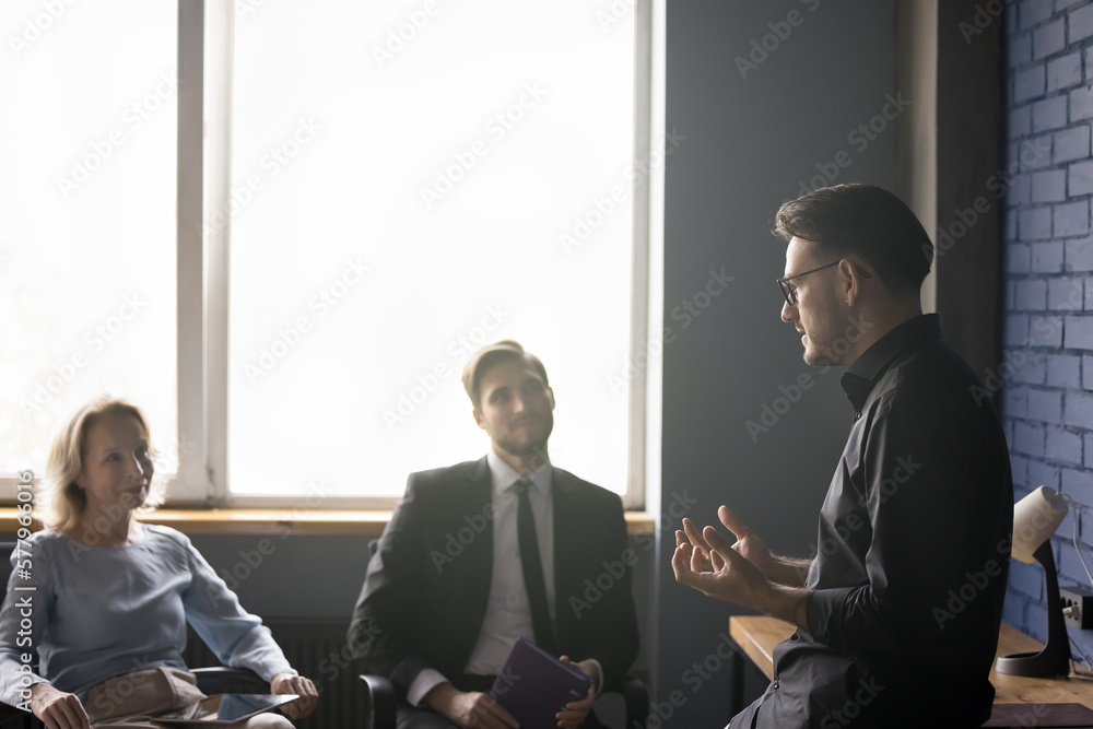 Smart confident boss discussing business ideas, strategy, plan with ...