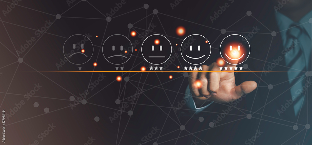 Businessman pressing smiley face emoticon on virtual touch screen ...