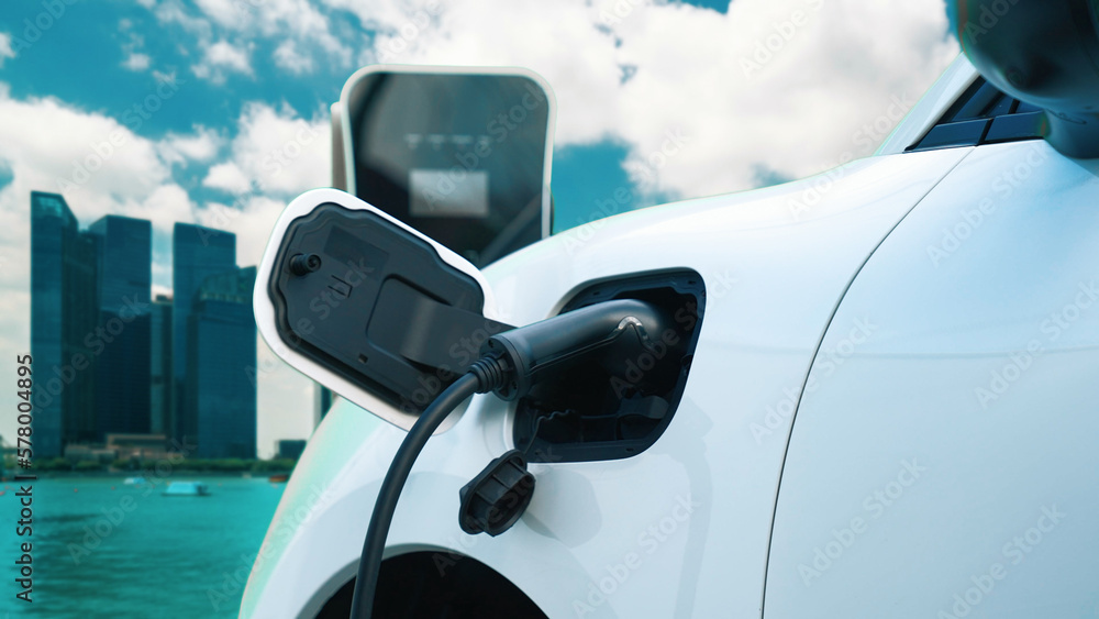 Electric vehicle, EV car recharges battery energy at charging station ...