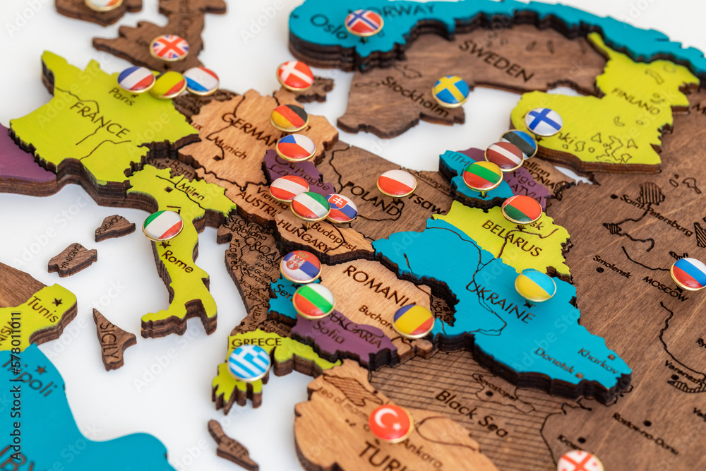 map of europe with flags, lots of round metal buttons with different ...