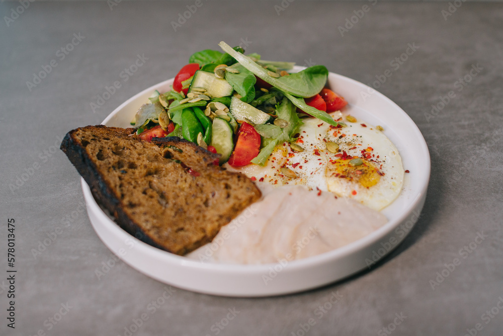 Food on an elegant white plate, lunch or dinner dish. Delicious food in ...