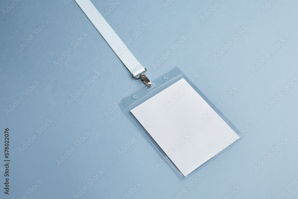 Transparent badge mockup isolated on blue background. Plain empty name ...