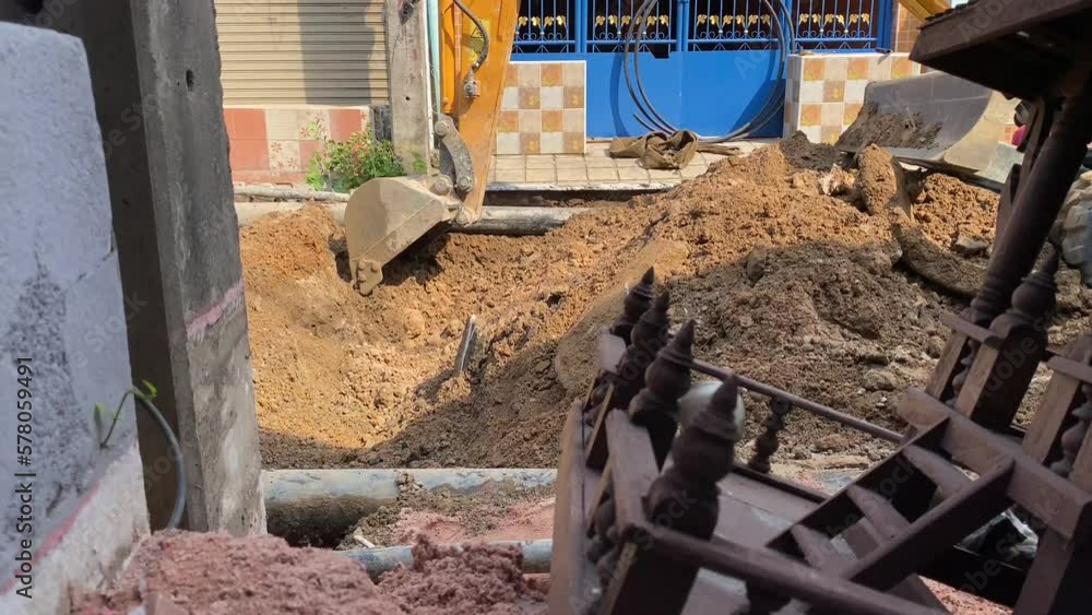Construction site outdoor sunny day digging soil ground for water ...