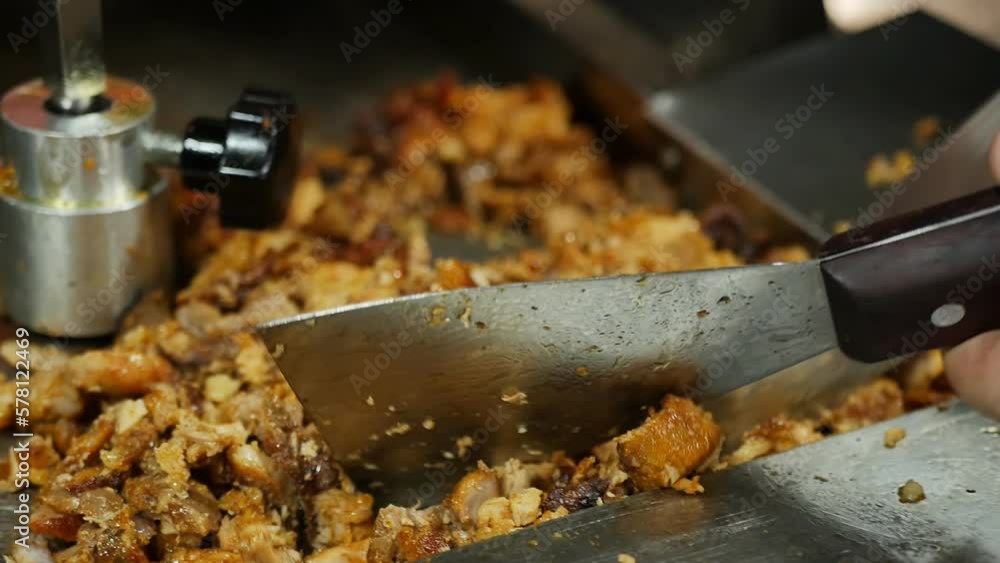 Vídeo do Stock: The process of cutting fried meat into small pieces ...
