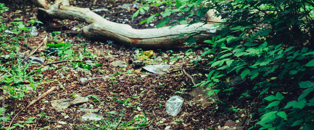 Foto de Garbage pile in forest among plants. Toxic plastic into nature ...