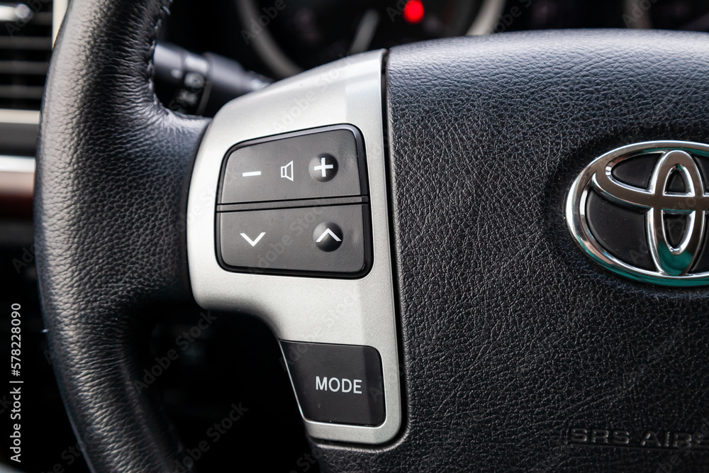 View to the interior of Toyota Land Cruiser 200 with dashboard, clock ...