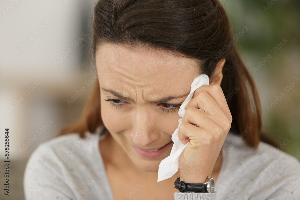 sad woman crying at home Stock Photo | Adobe Stock