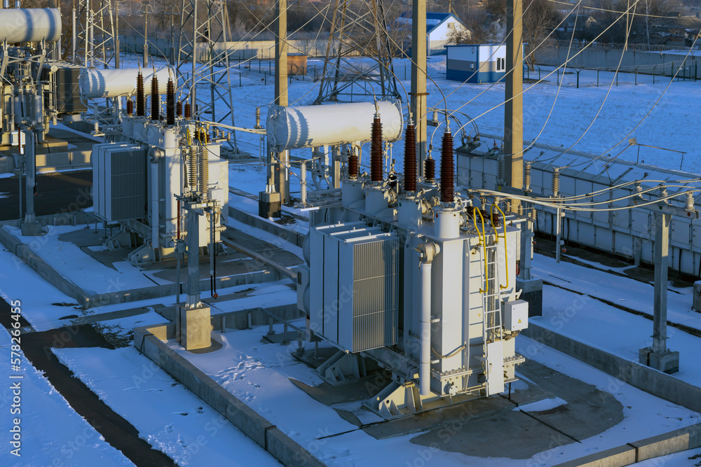 Top view of a small electrical substation with rows of transformers ...
