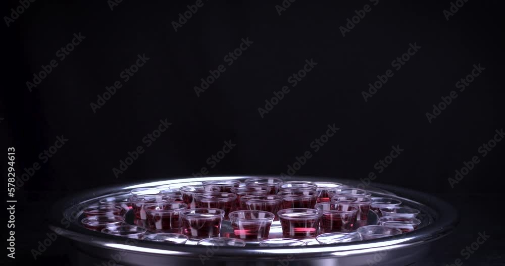Communion glass cups on tray filled with wine the symbol of Jesus ...