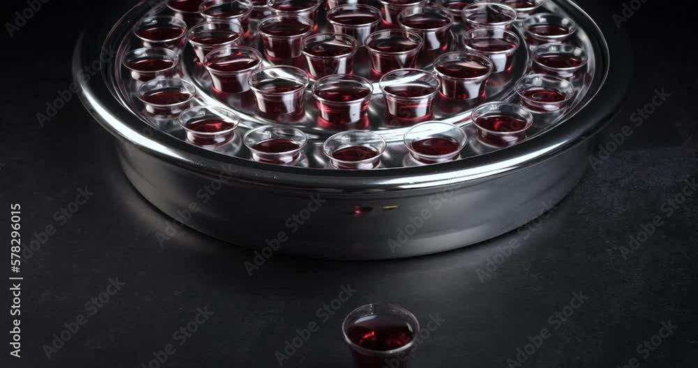 Communion glass cups on tray filled with wine the symbol of Jesus ...