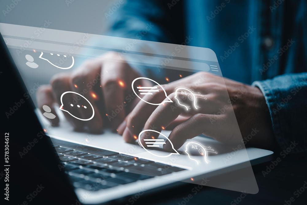 Businessman using laptop keyboard to chat with AI or Artificial ...