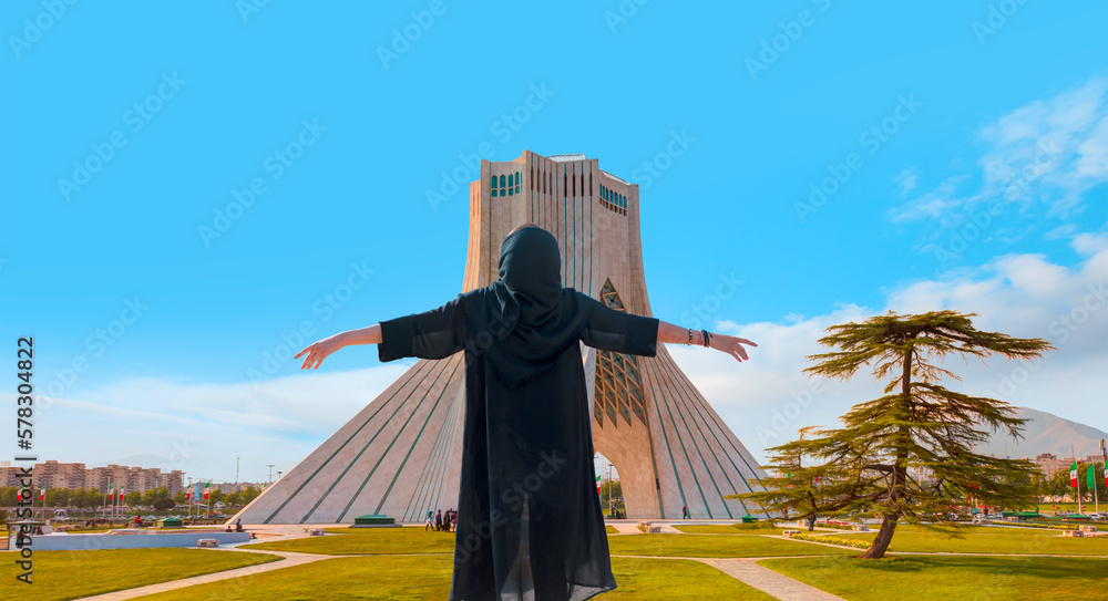 Beautiful Iranian girl wearing abaya with arms up happy - Azadi Tower ...