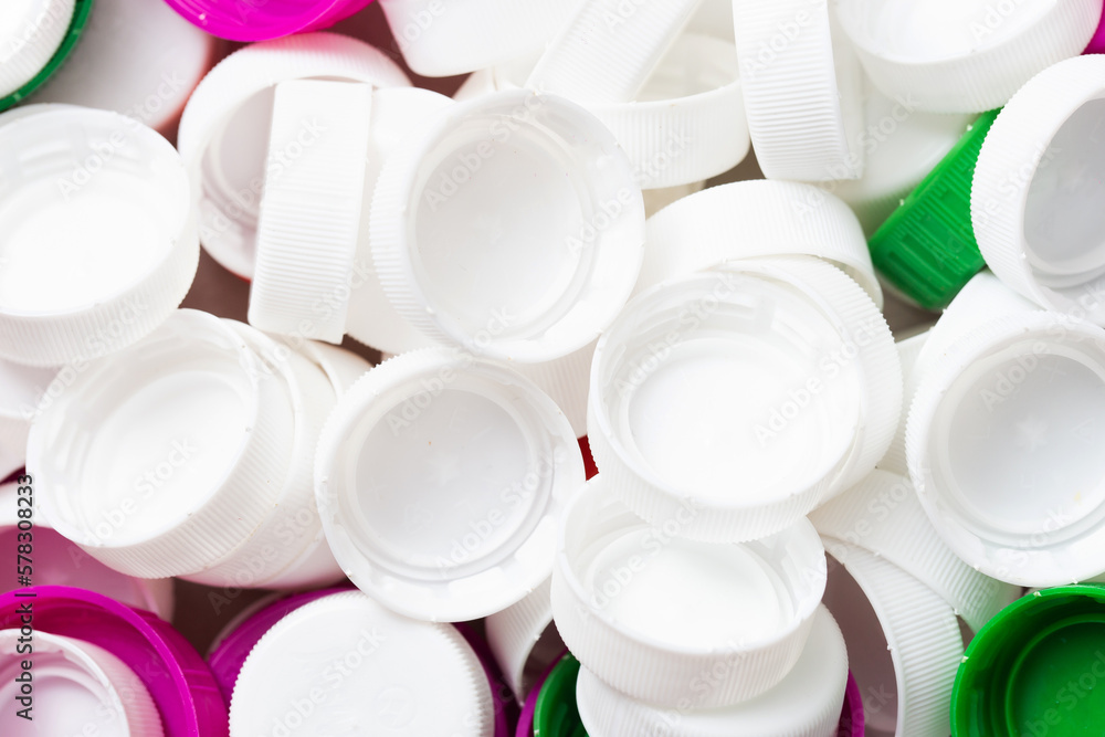 Plastic bottle caps background. Collecting bottle caps texture. White ...