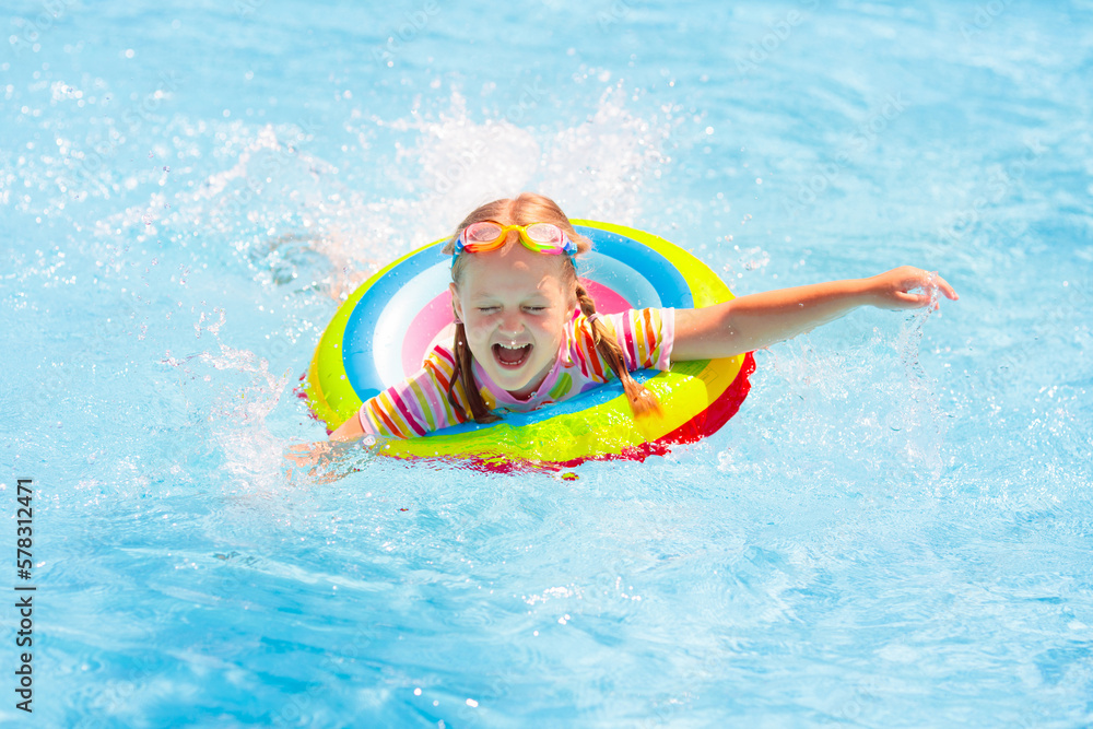 Child in swimming pool. Kids swim. Water play. Stock Photo | Adobe Stock