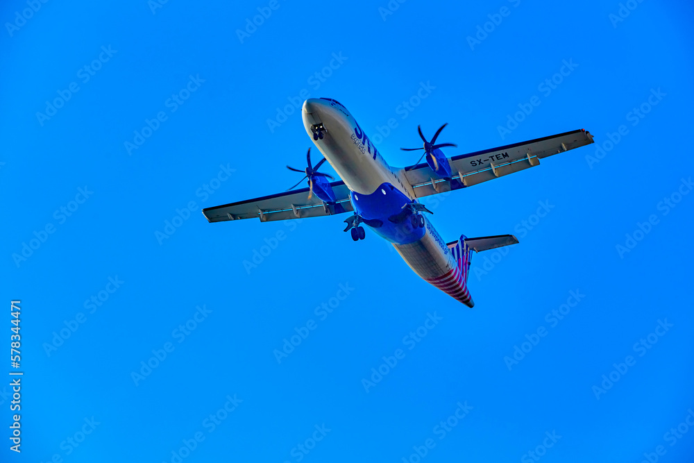 Santorini, Greece - July 09, 2022: SKY express plane is flying in sky ...