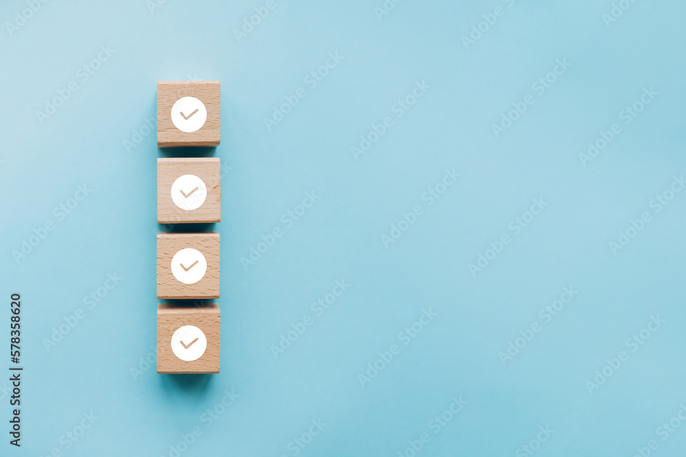 Checklist concept, Check mark on wooden blocks, blue background with ...