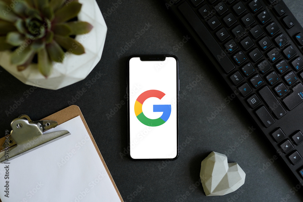 Mobile phone with the Google Logo on the screen Stock Photo | Adobe Stock