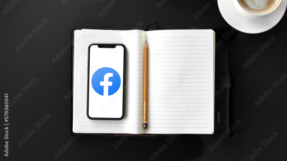 Mobile phone with the Facebook Logo on the screen Stock Photo | Adobe Stock
