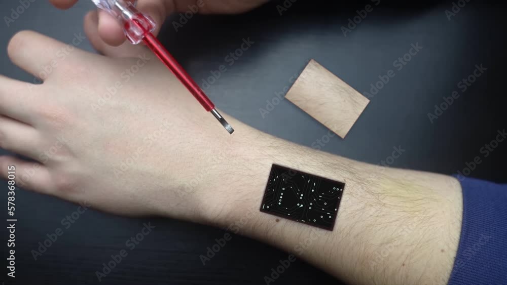 Robot arm concept. Man shows biomechanical prosthetic hand. Guy repairs ...