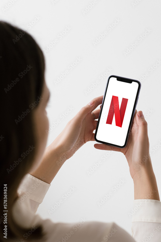 Mobile phone with the Netflix Logo on the screen Stock Photo | Adobe Stock