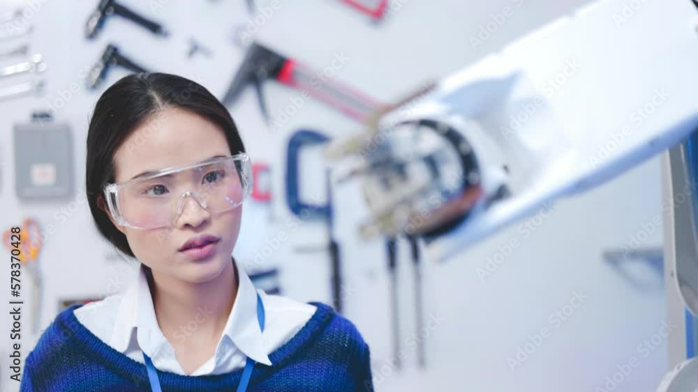 Engineers Maintenance Robot Arm at Lab. he are in a High Tech Research ...