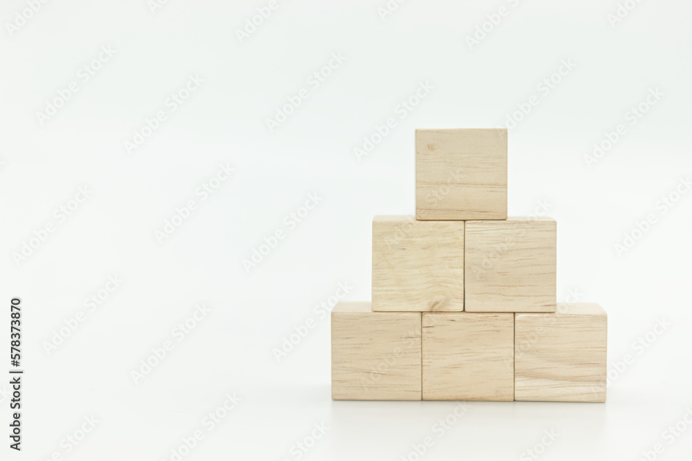wooden blank block cubes arranged in pyramid shape on white background ...