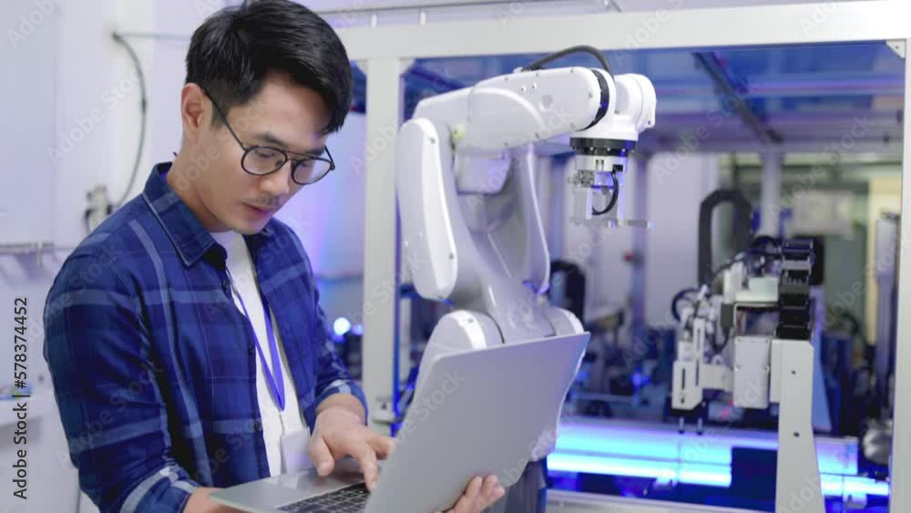 Engineers Maintenance Robot Arm at Lab. he are in a High Tech Research ...