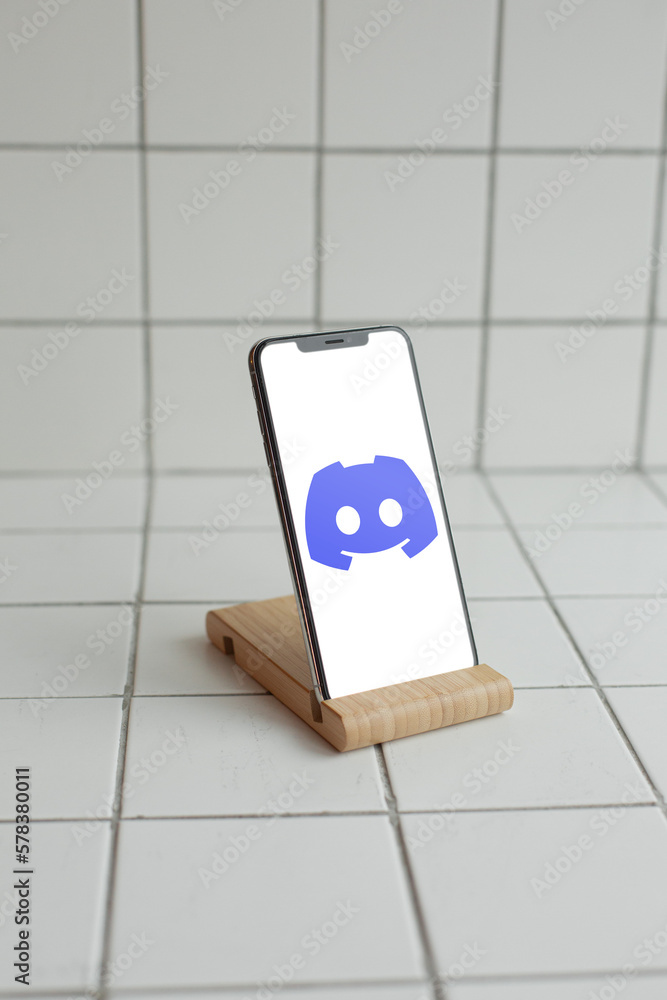 Mobile phone with the Discord Logo on the screen foto de Stock | Adobe ...