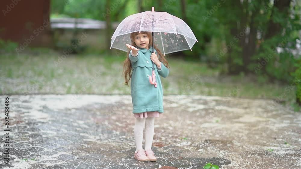 A beautiful little girl with brown hair and a toothless smile, wearing ...
