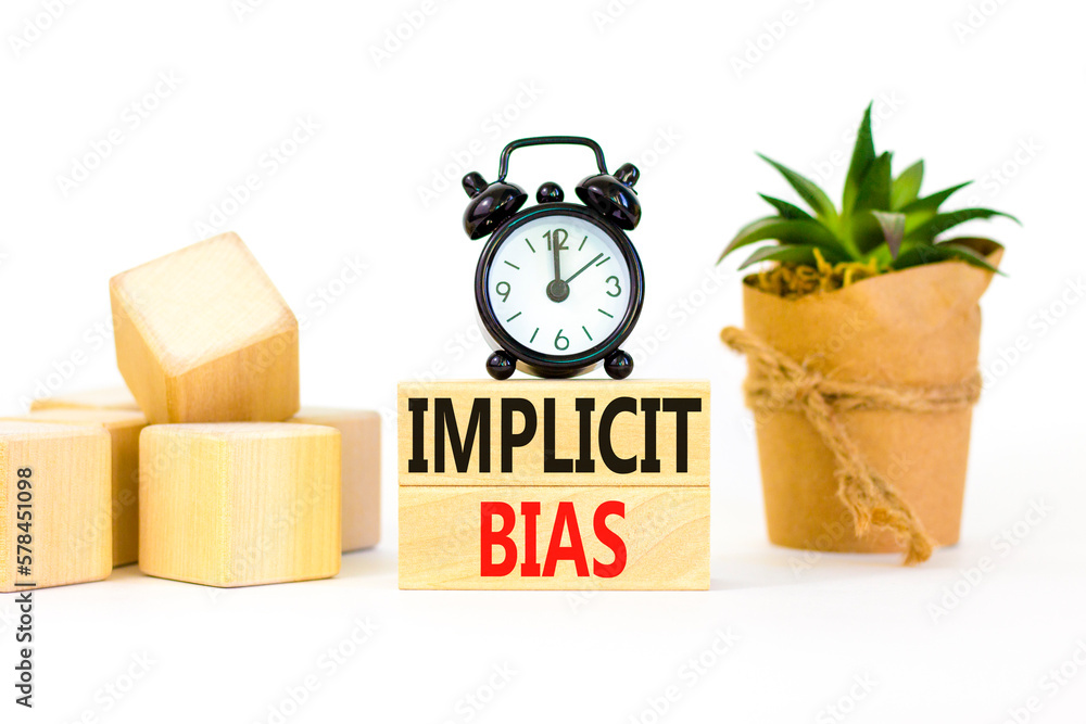 Implicit bias symbol. Concept words Implicit bias on wooden block. Beautiful white table white ...