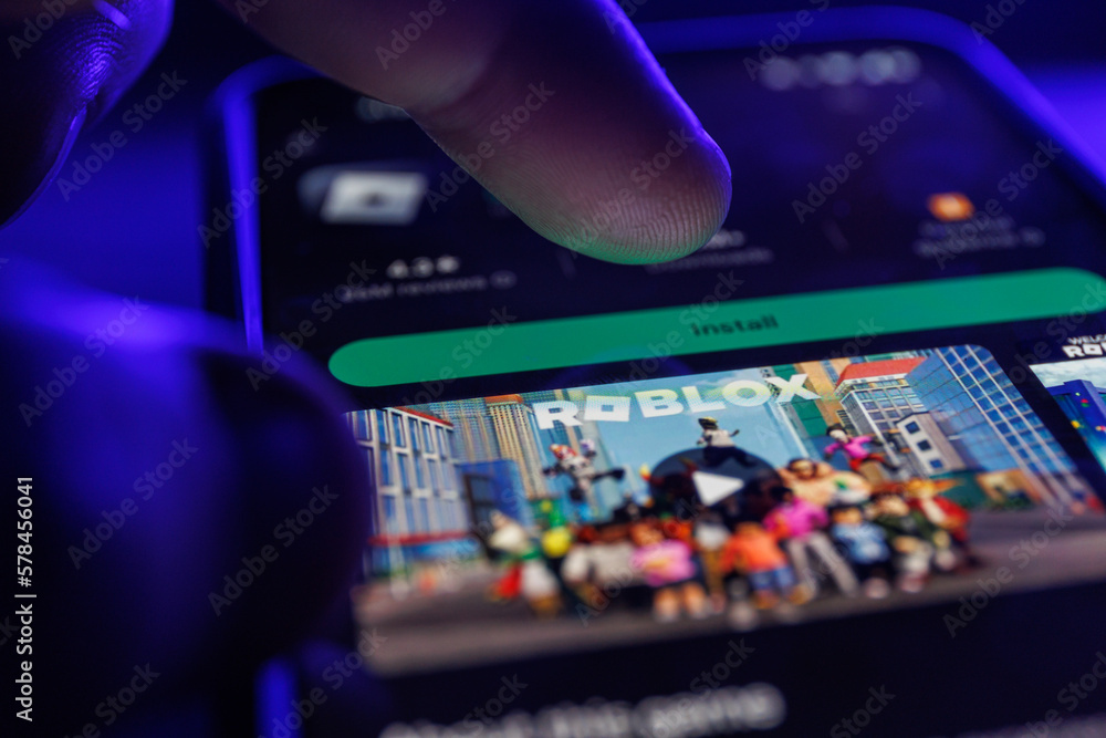 Roblox game app on smartphone screen. Close up shot of Roblox game app ...