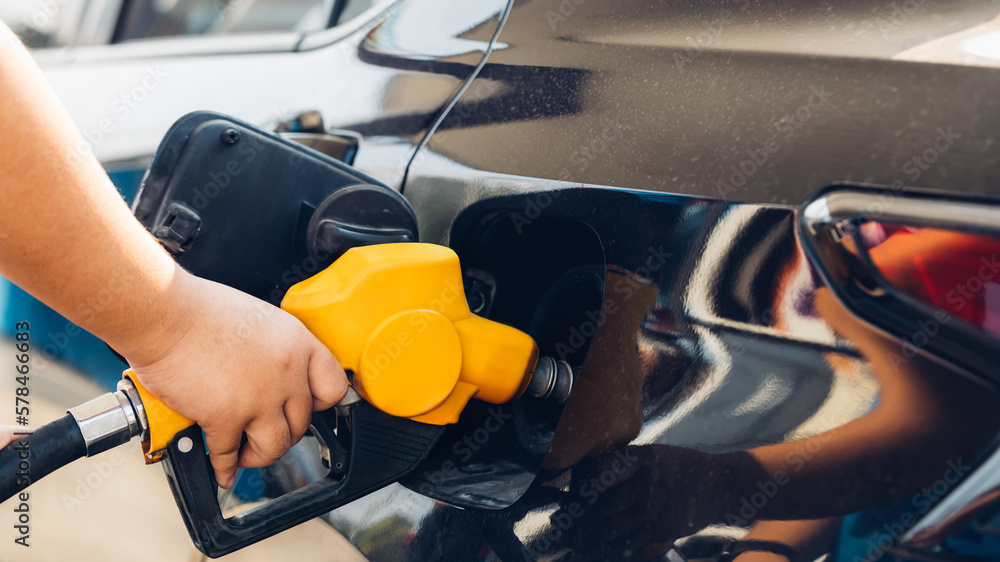 Man Refill and filling Oil Gas Fuel at station. Gas station - refueling ...