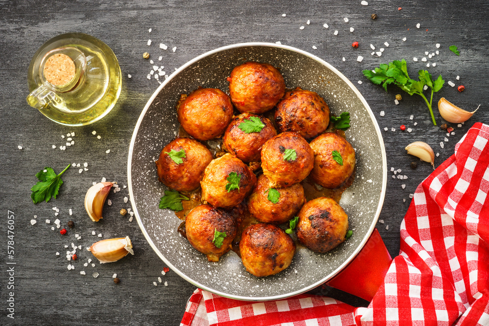Meatballs in tomato sauce in the skillet at dark table. Flat lay image ...