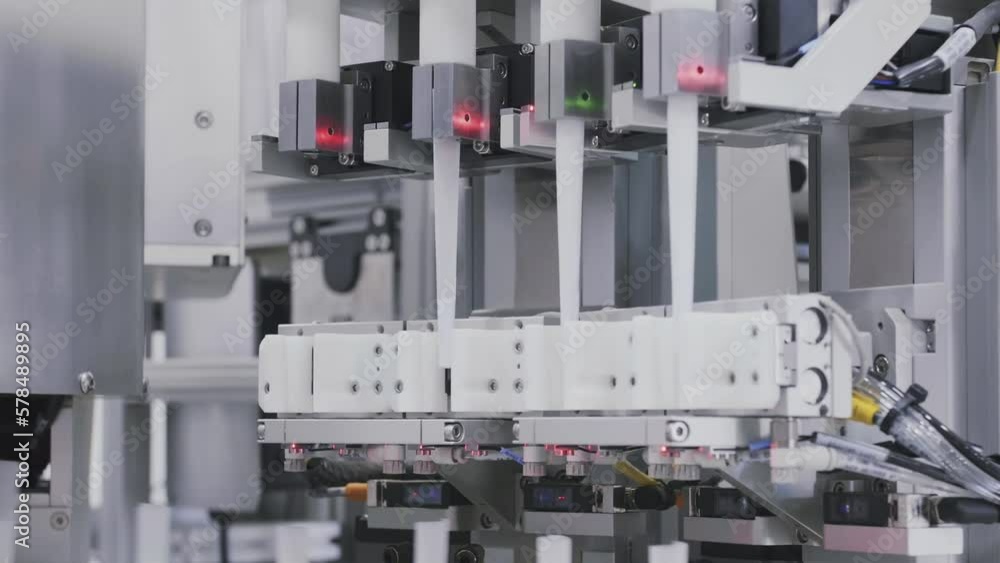 Automated Robotic equipment at factory. Commercial mass production at ...